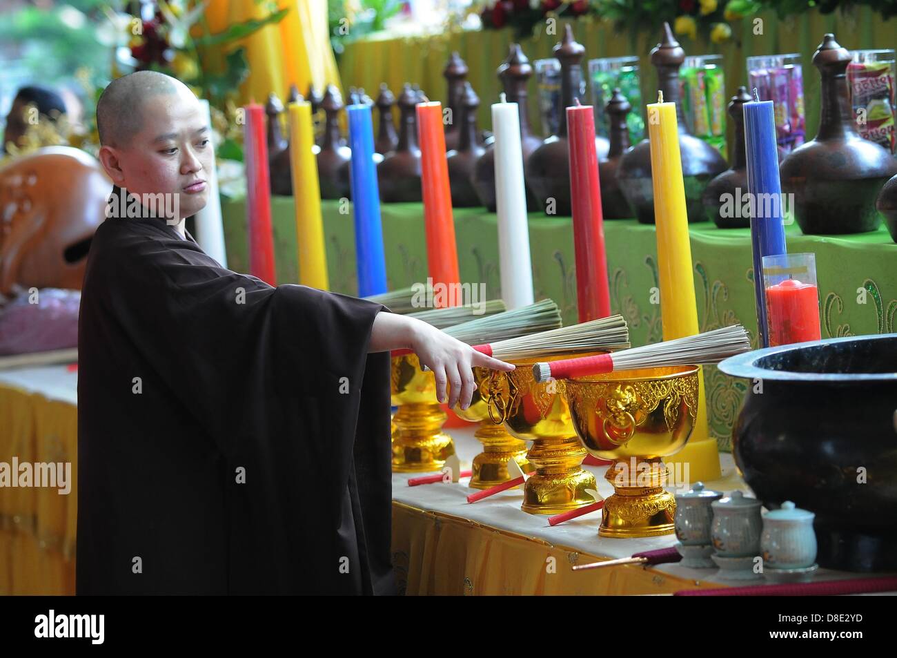 Magelang, Indonesia - A monk preparing blessing water that will be used ...