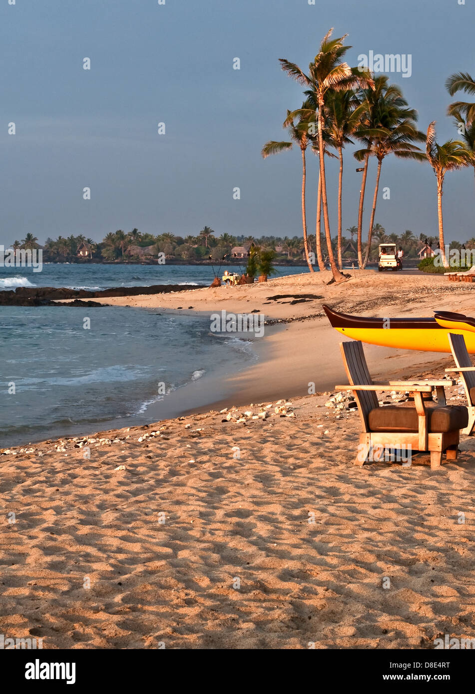 tropical beach scene at sunset, with the sunshine very warm touching ...