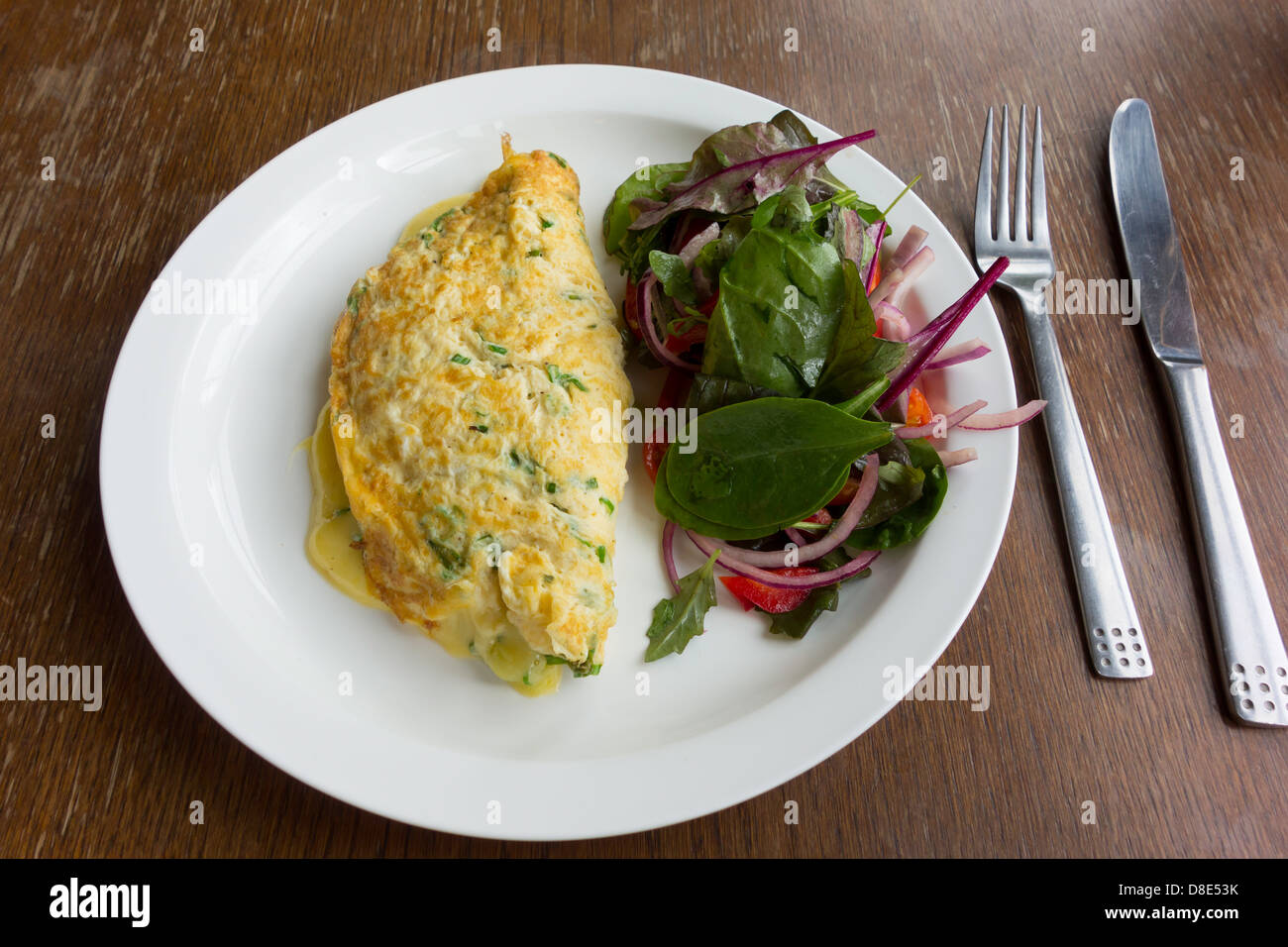 Lunch of cheese and spring onion omelette and salad Stock Photo - Alamy