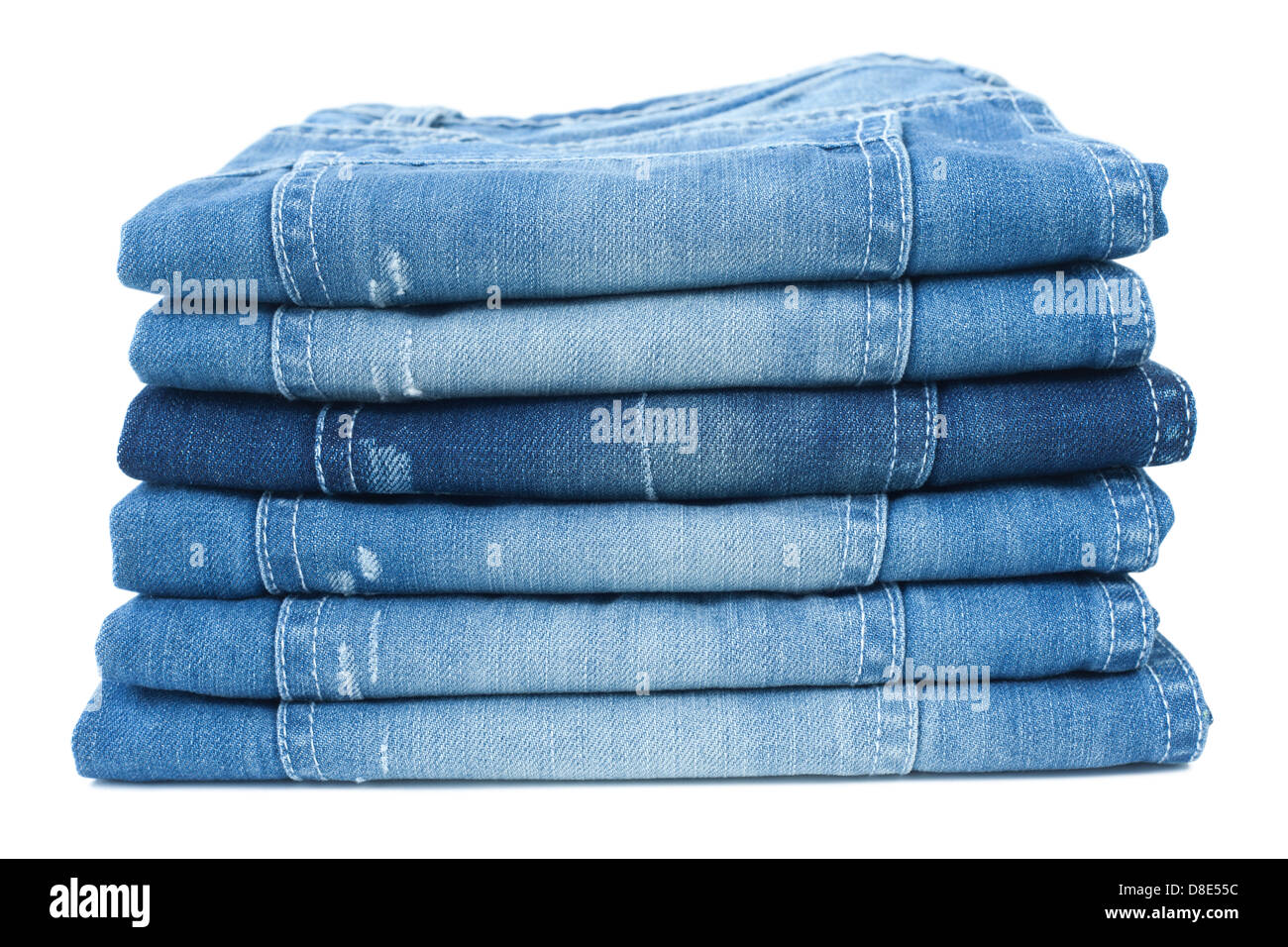 Stack of blue jeans isolated on white background Stock Photo - Alamy