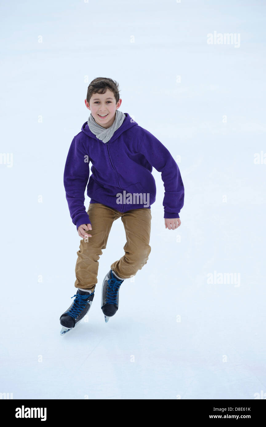 Boy ice-skating on a frozen lake Stock Photo - Alamy