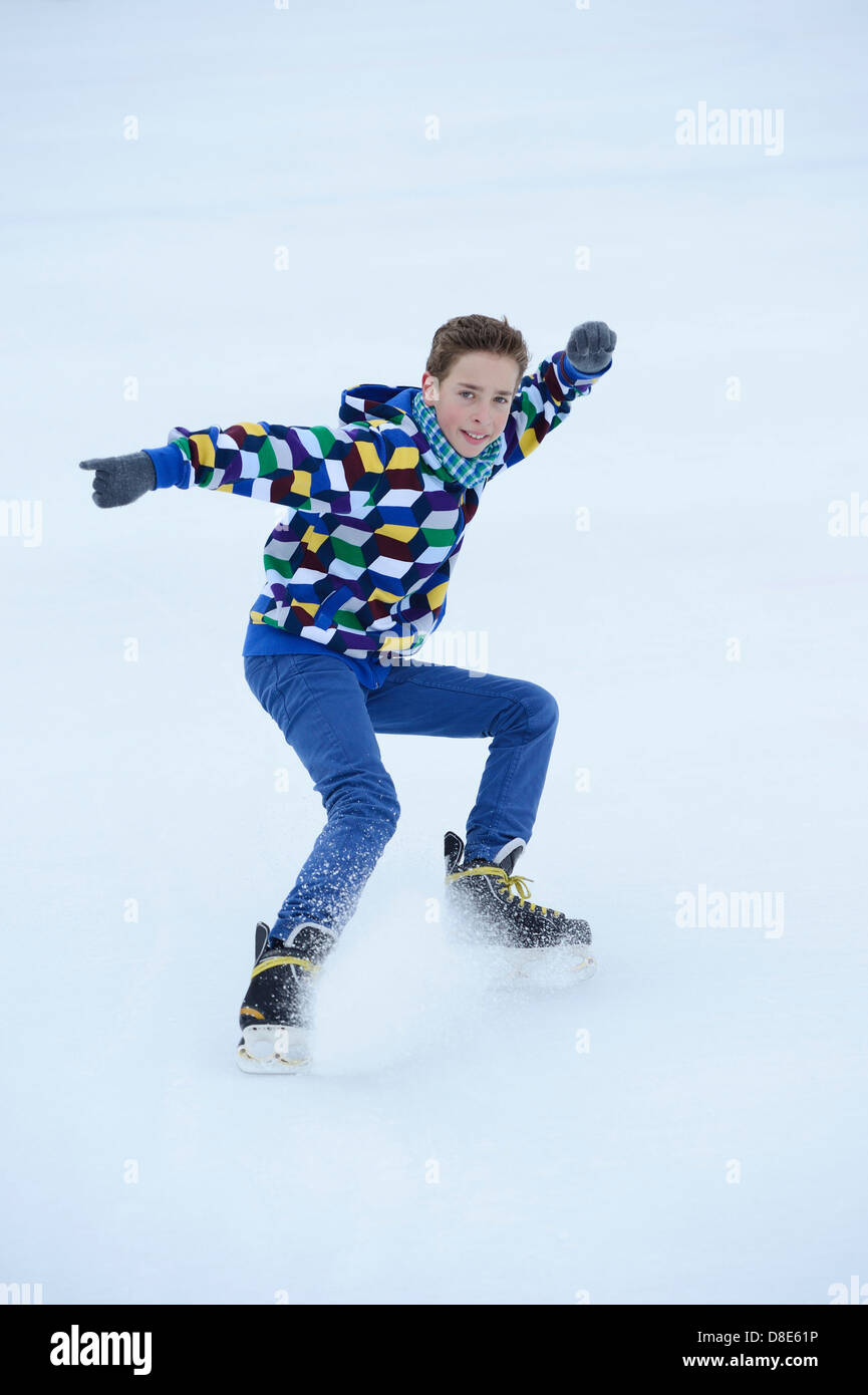 Boy ice-skating on a frozen lake Stock Photo - Alamy