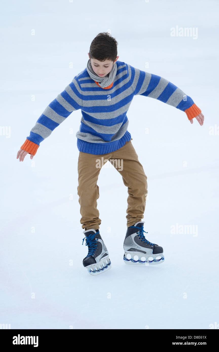Boy ice-skating on a frozen lake Stock Photo - Alamy