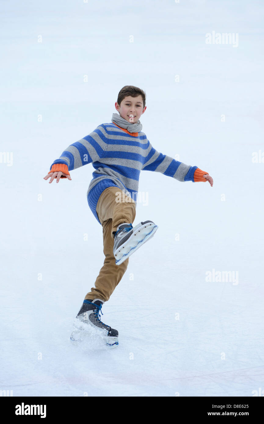Boy ice-skating on a frozen lake Stock Photo - Alamy
