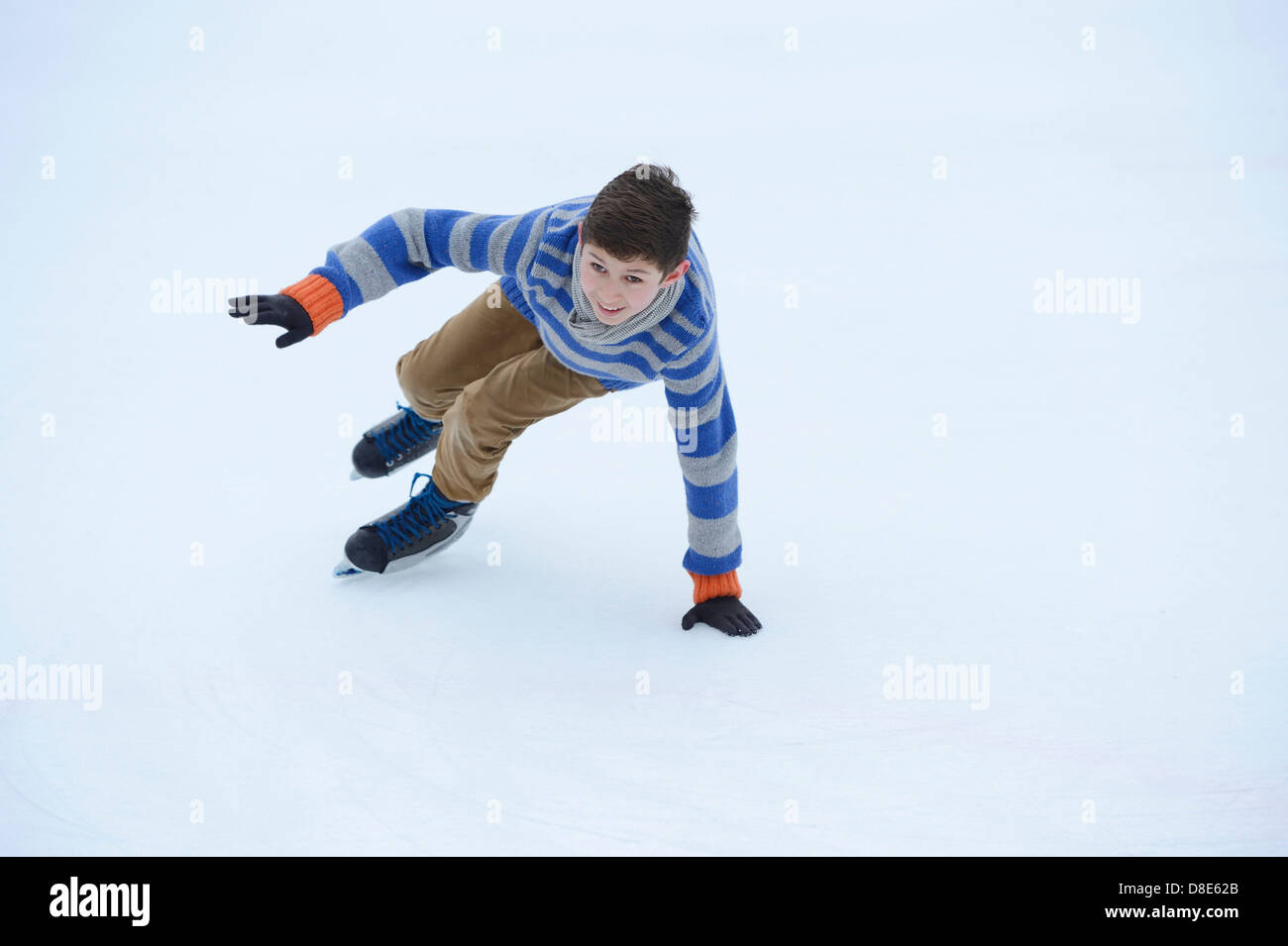 Boy ice-skating on a frozen lake Stock Photo - Alamy