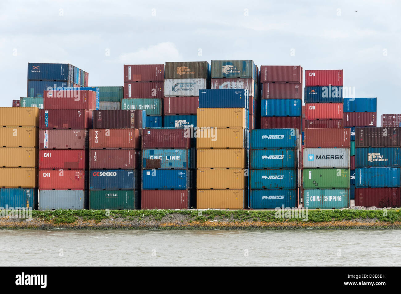 Stack of cargo containers at river bank, Rotterdam, Netherlands Stock ...