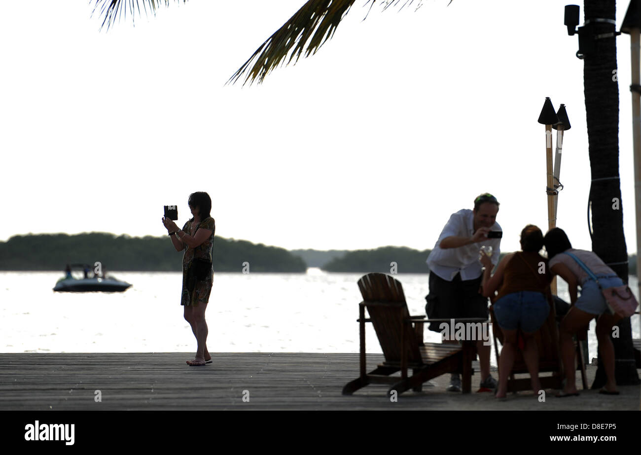Tourists relax at a beach esplanade at Florida Keys in Islamorada ...