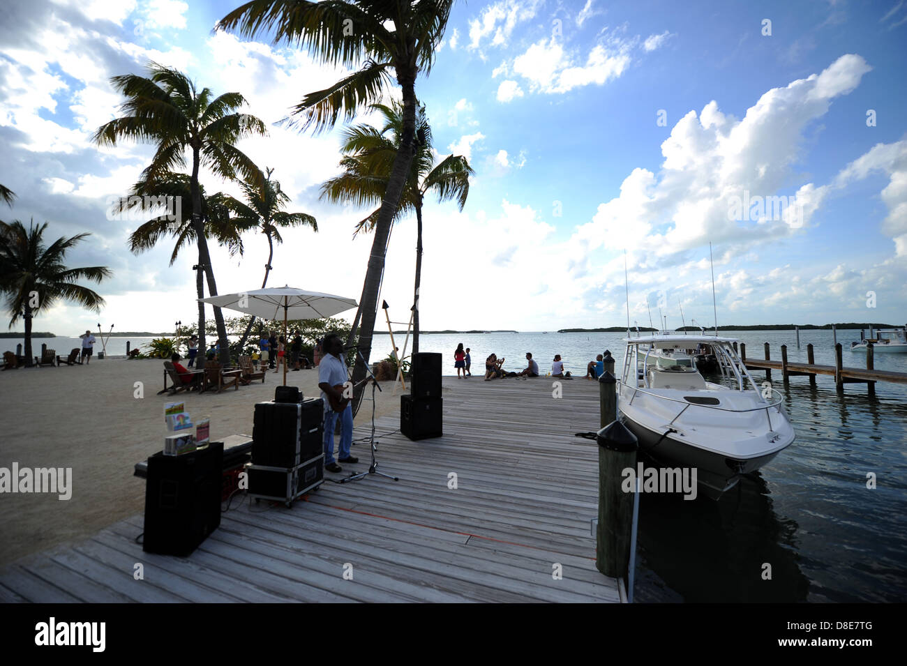 A musician plays music at a beach esplanade at Florida Keys in ...