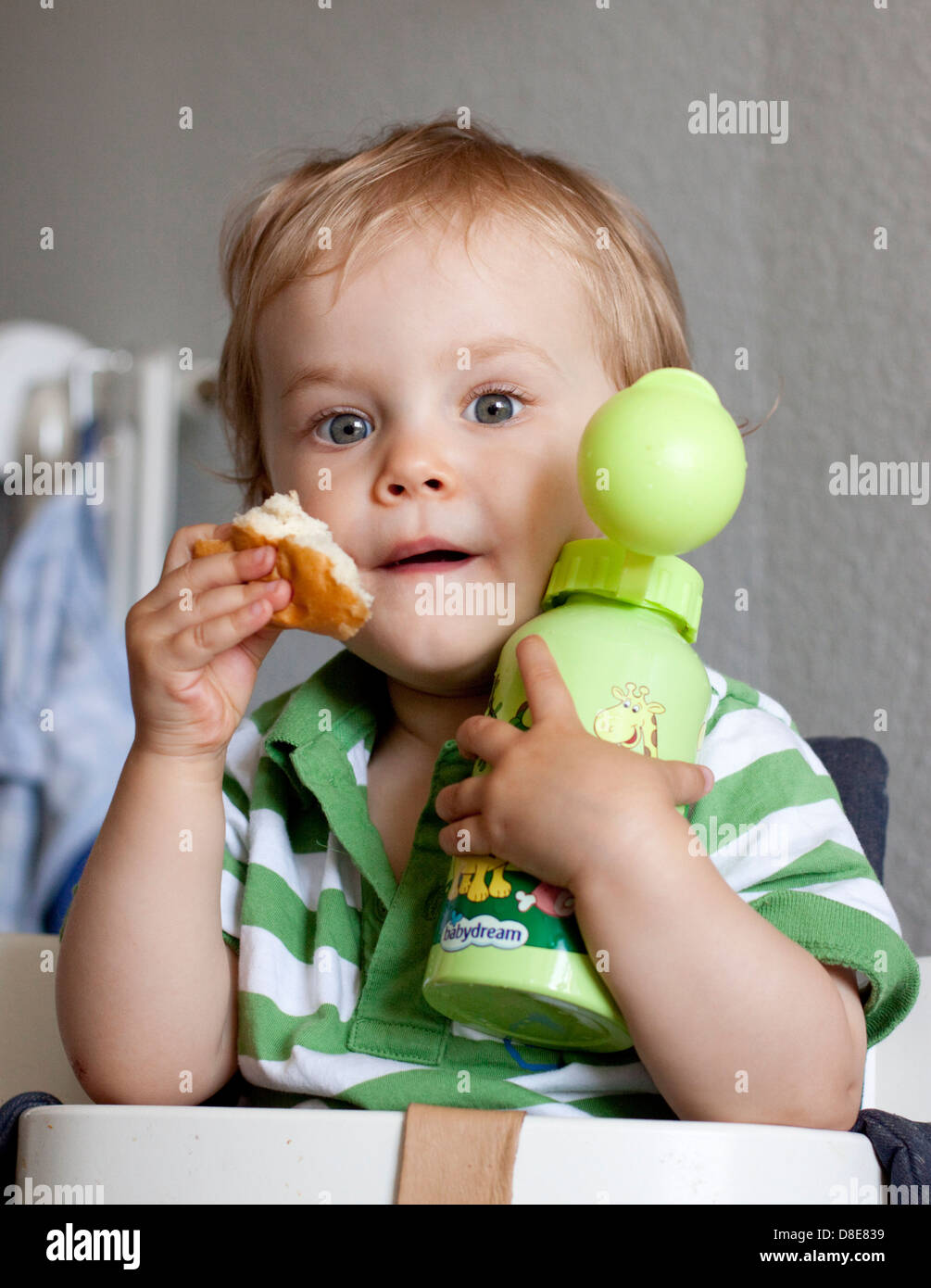 Toddler eating, portrait Stock Photo - Alamy