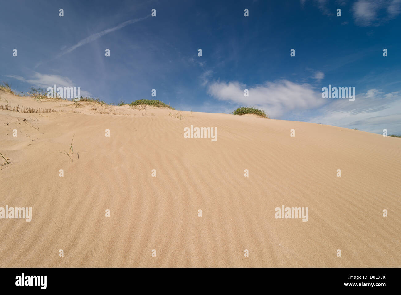 Low angle viewpoint take of a dune against the sky Stock Photo - Alamy