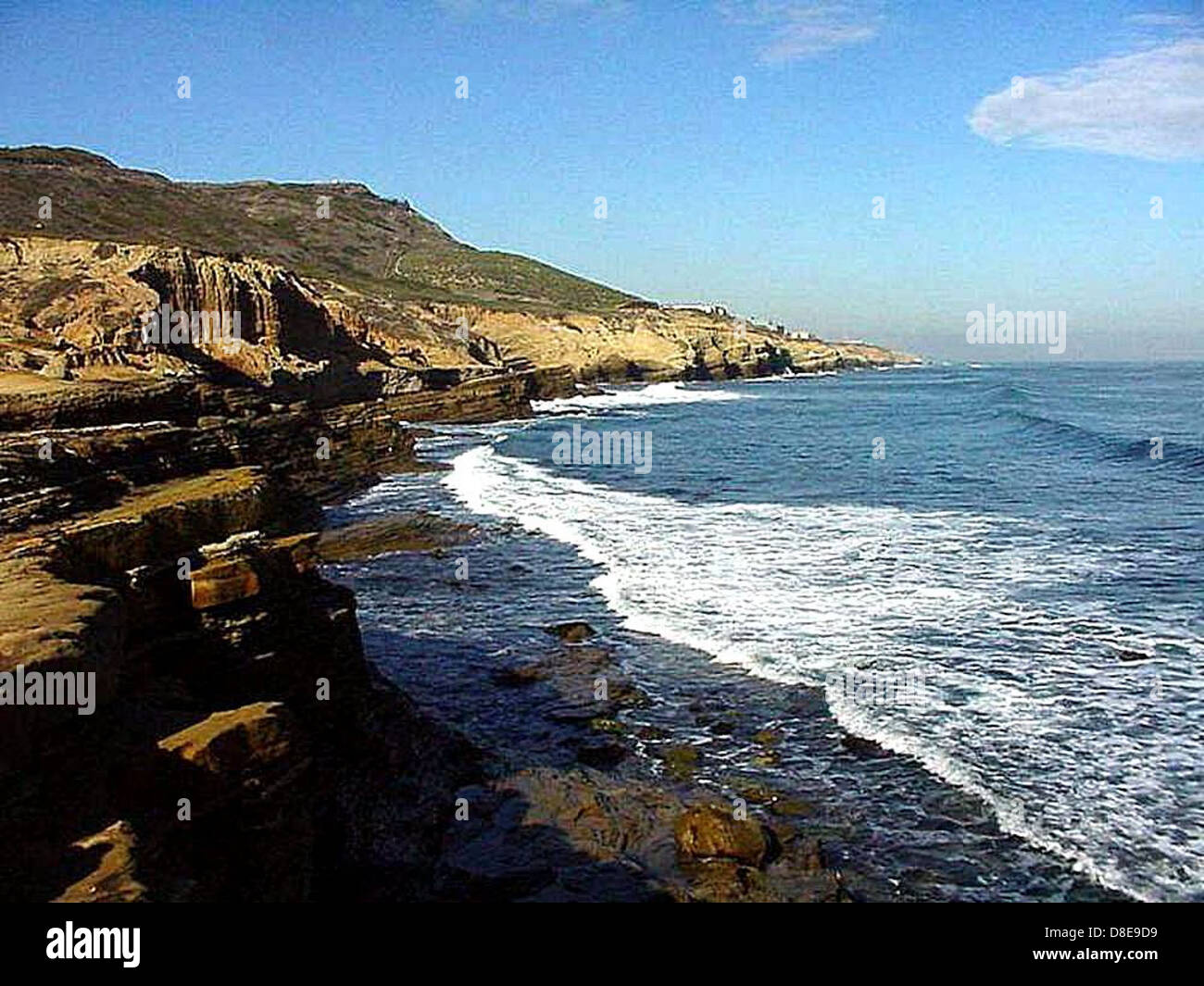 The image captures waves rolling onto the shore, with a view of the ...