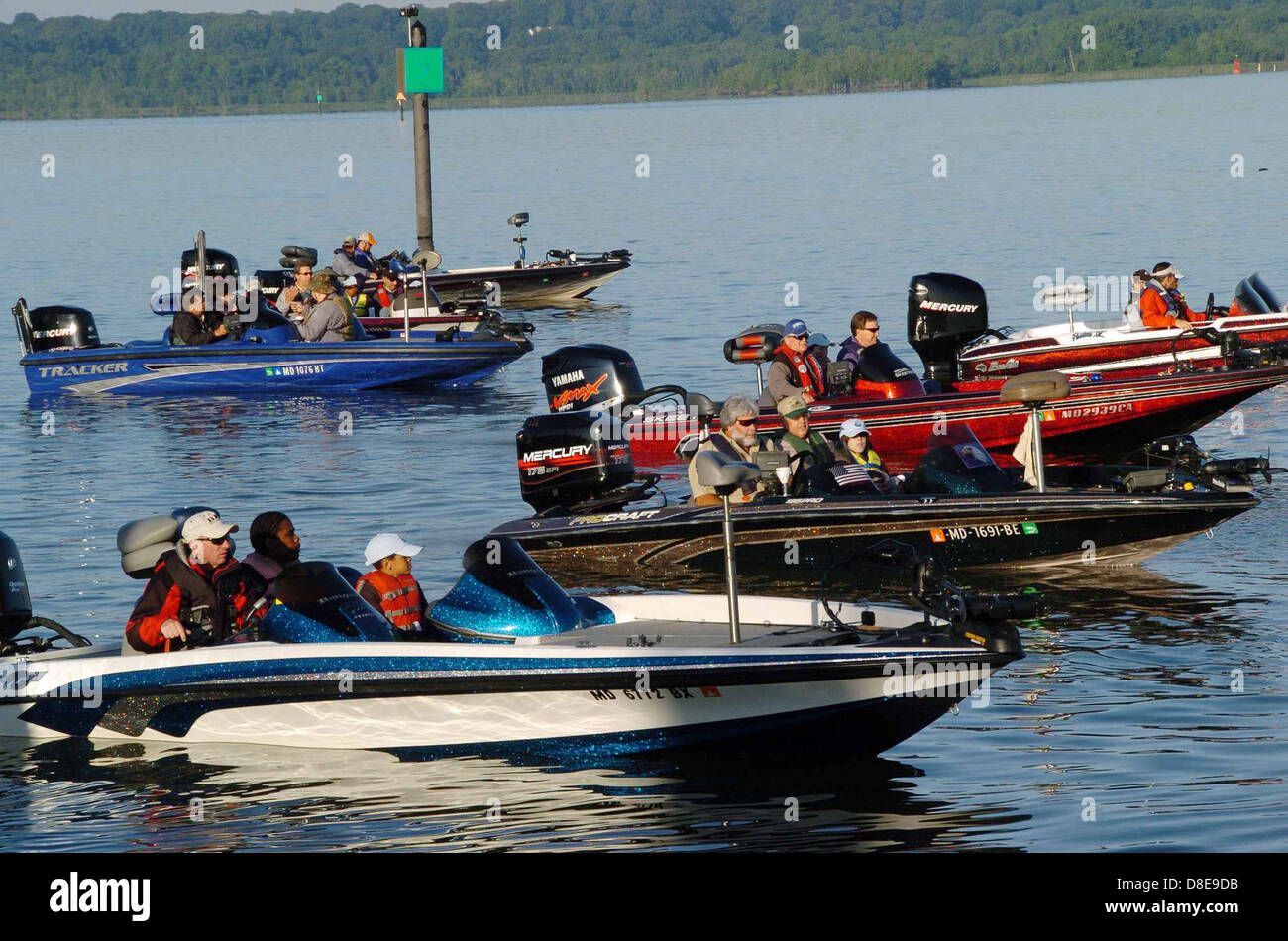 Several speedy boats with people in them Stock Photo - Alamy