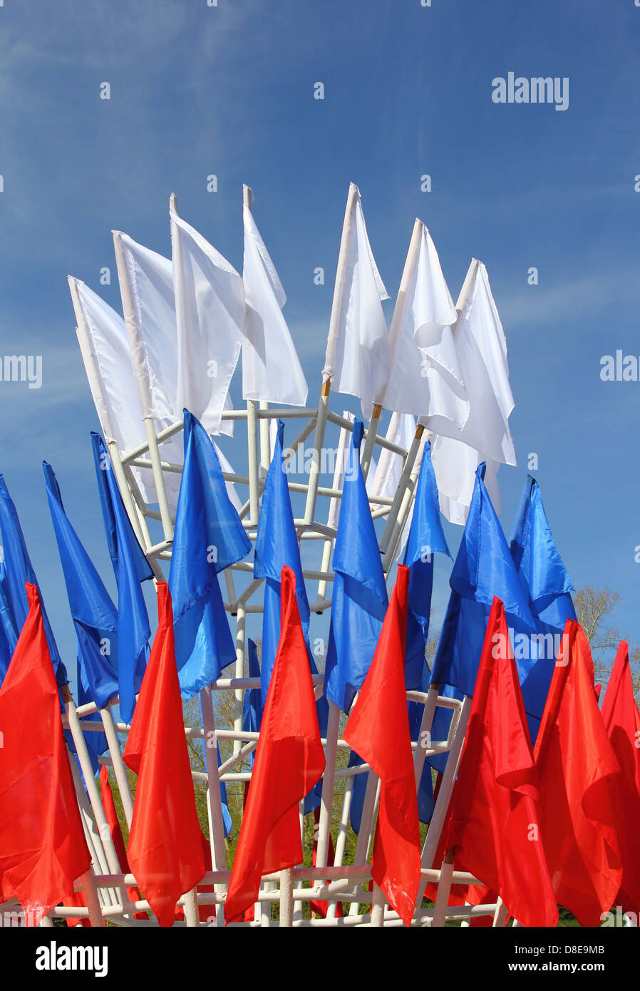 colored flags on a blue sky background Stock Photo - Alamy