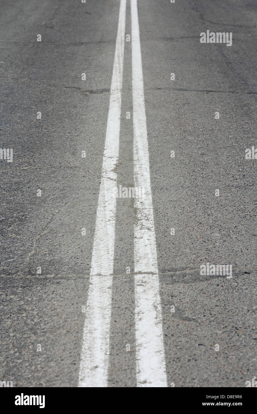 Asphalt highway with two white stripes Stock Photo - Alamy