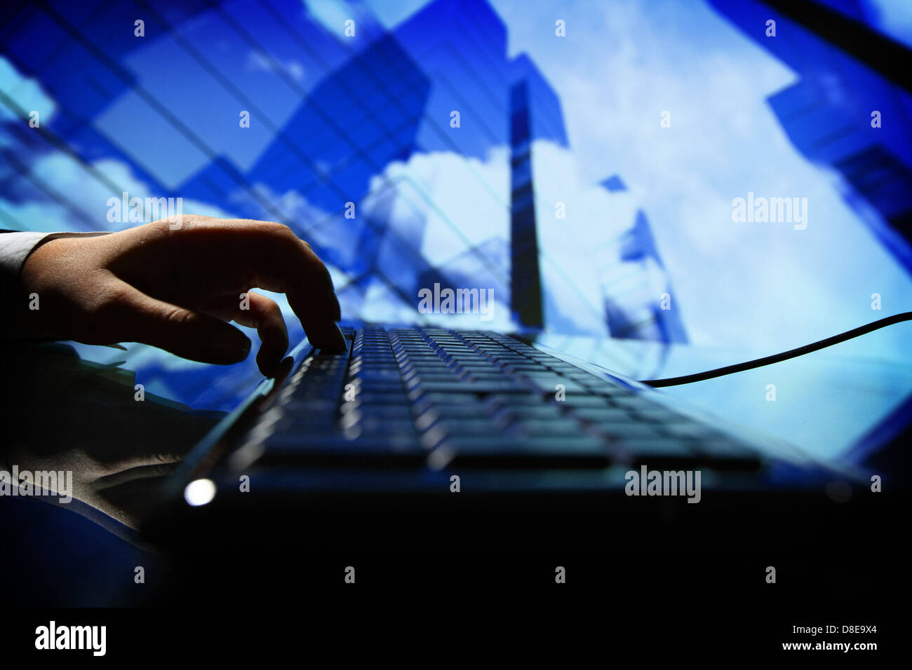 reseller work on keyboard skyscrapers on background Stock Photo - Alamy