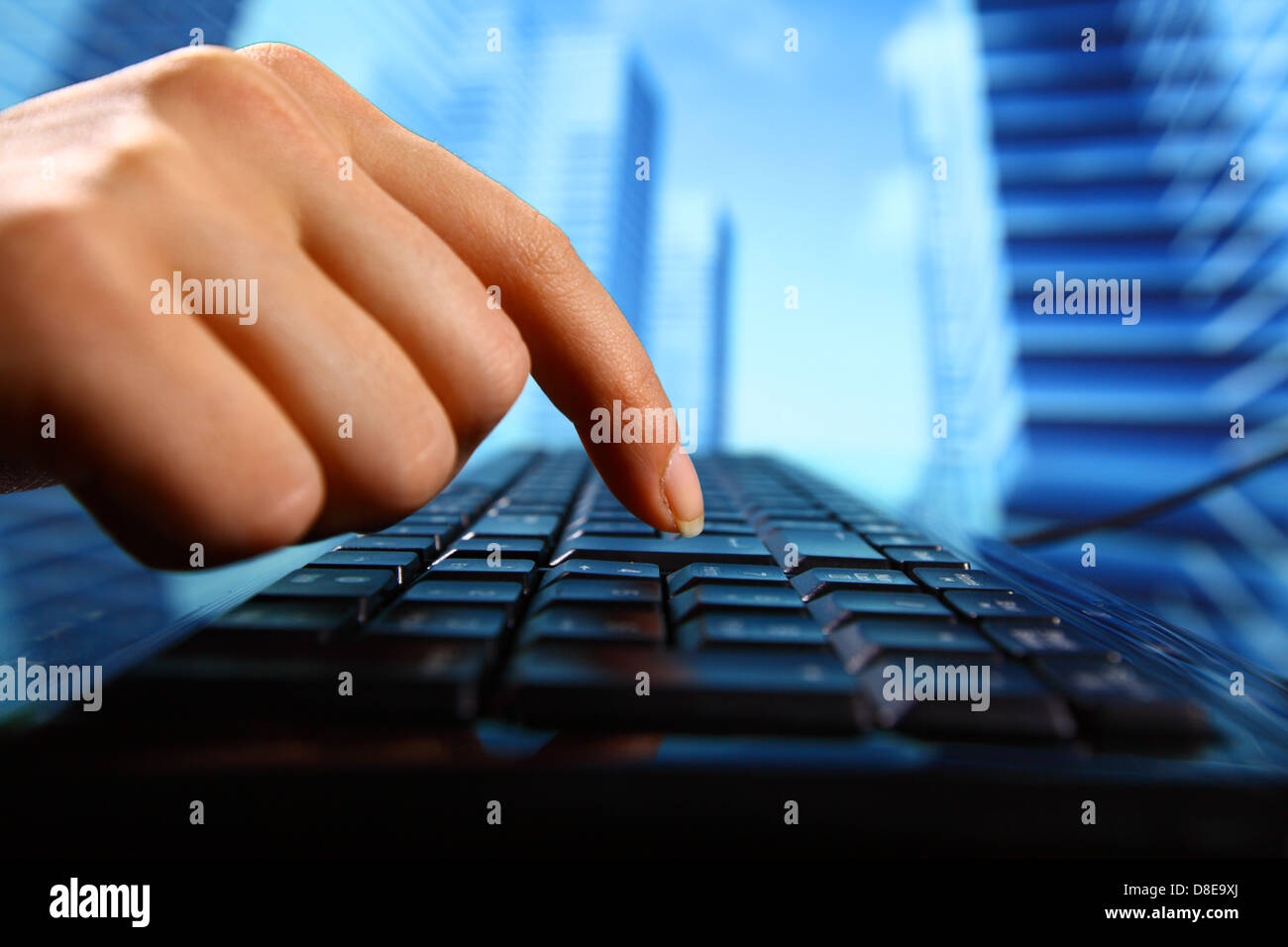 reseller work on keyboard skyscrapers on background Stock Photo - Alamy