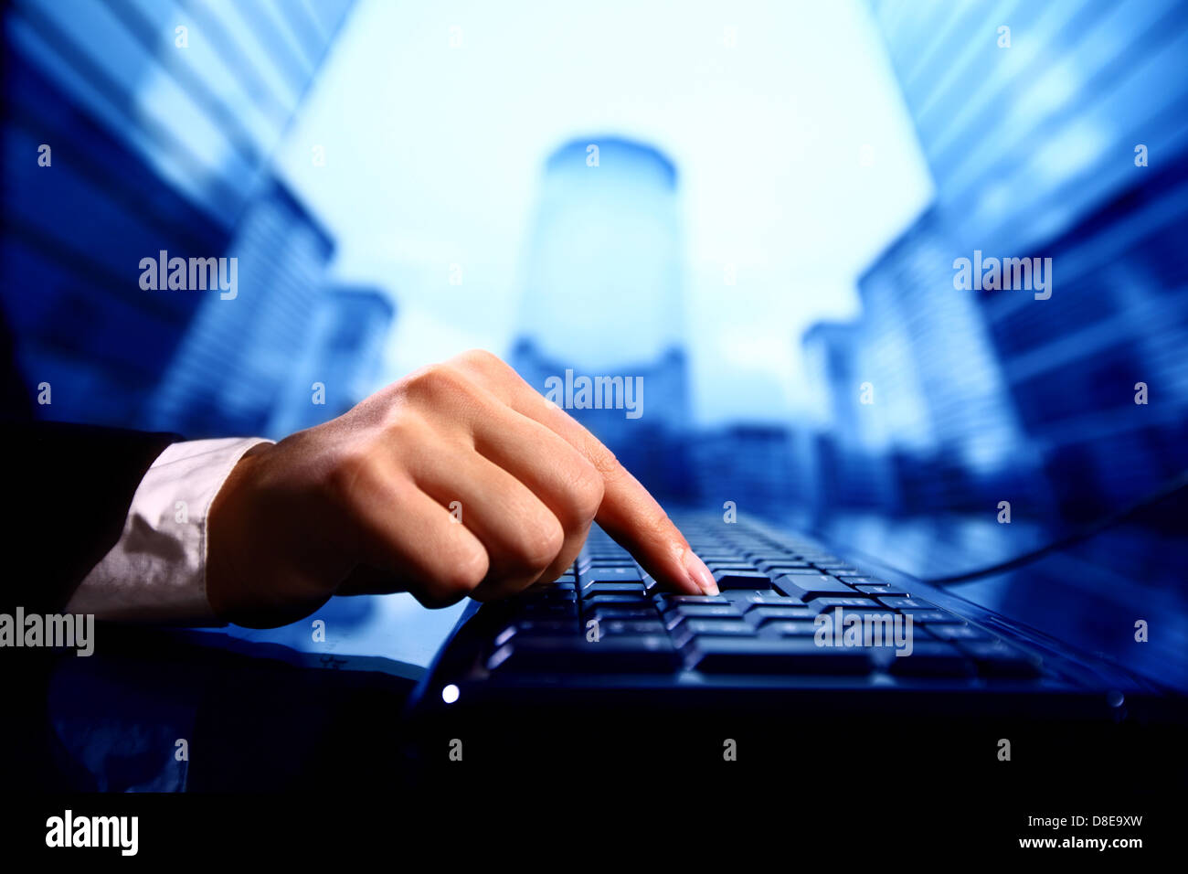 reseller work on keyboard skyscrapers on background Stock Photo - Alamy