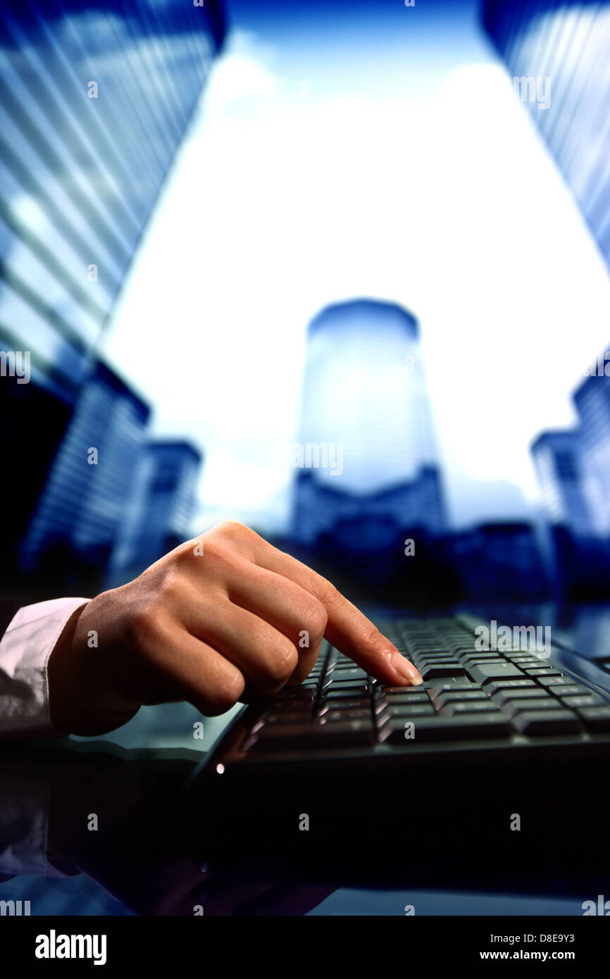 reseller work on keyboard skyscrapers on background Stock Photo - Alamy