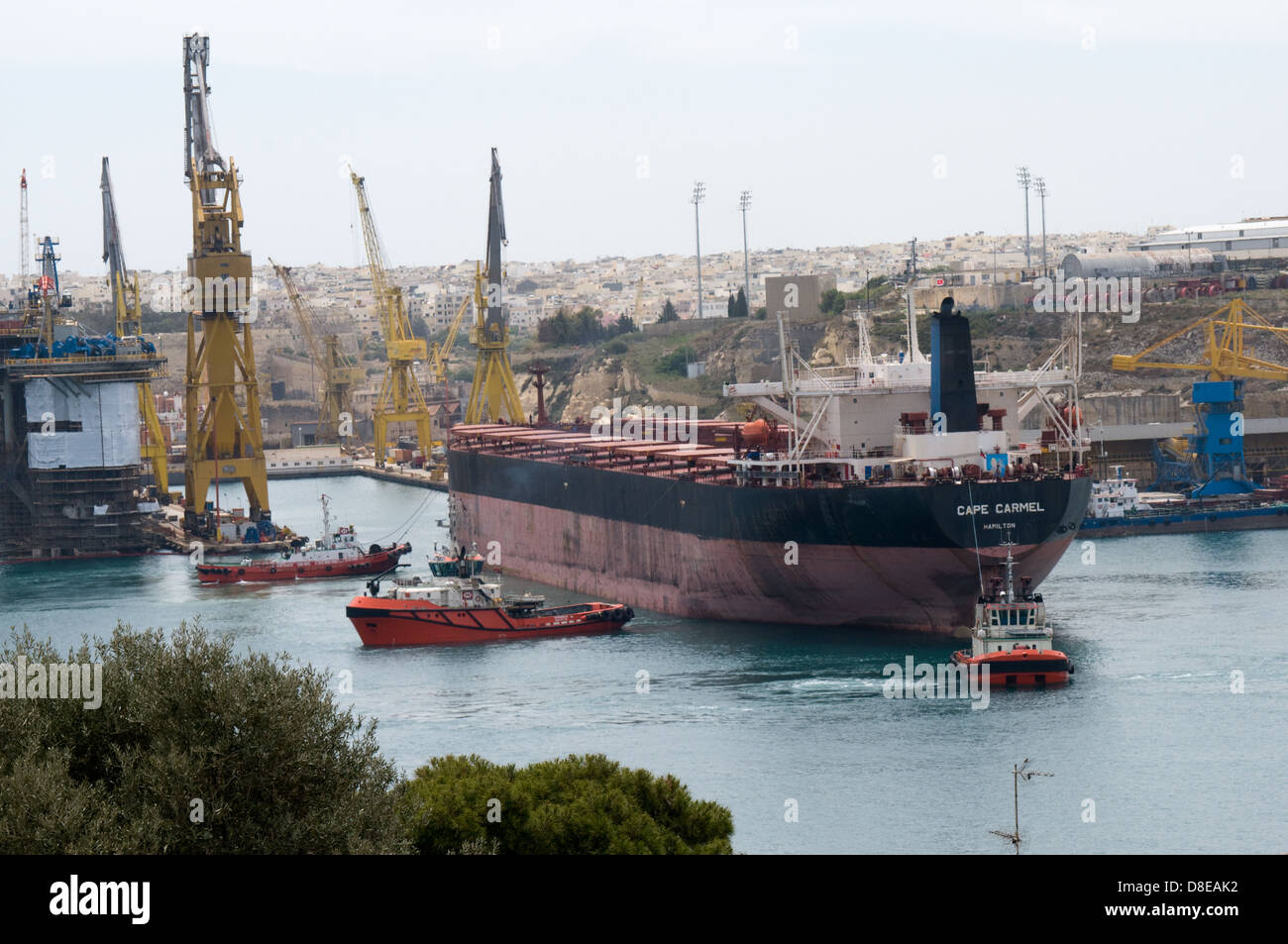 The bulk freighter Cape Carmel is carefully guided into the Malta Dry ...