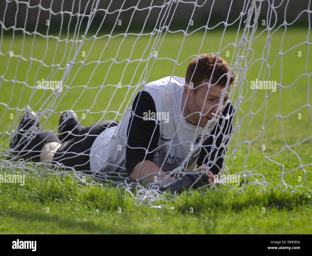 A footballer contemplates a missed chance to score a goal Stock Photo ...