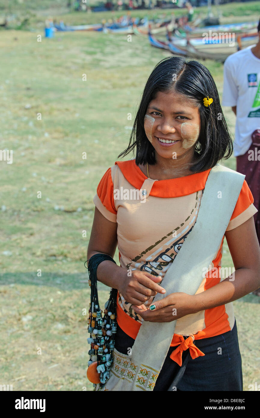 Beautiful Burmese girl with thanakha facial painting Stock Photo - Alamy