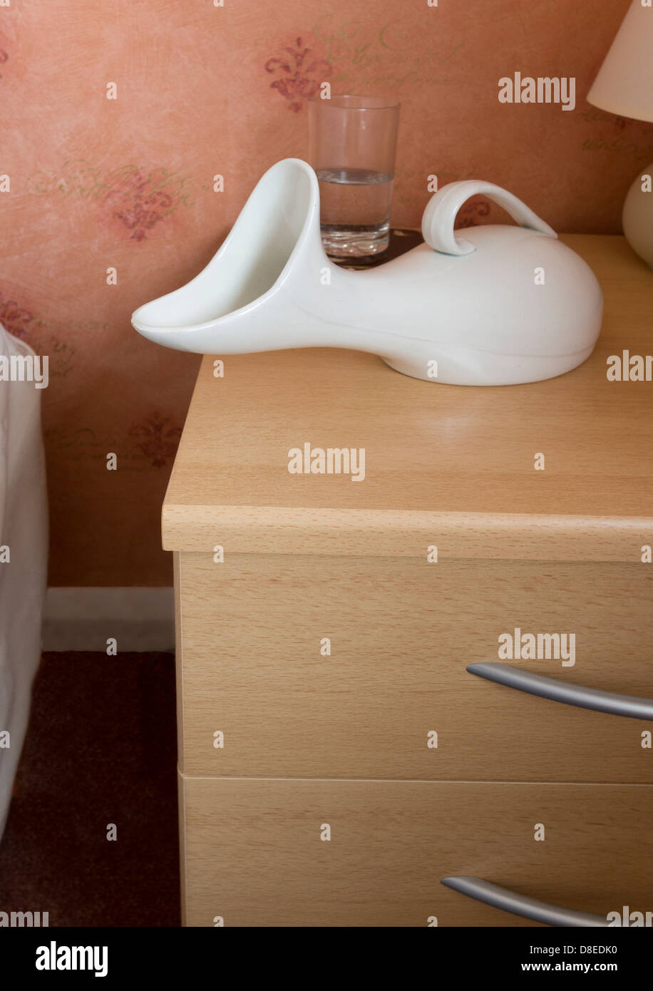 Female urine bottle on bedside cabinet Stock Photo - Alamy