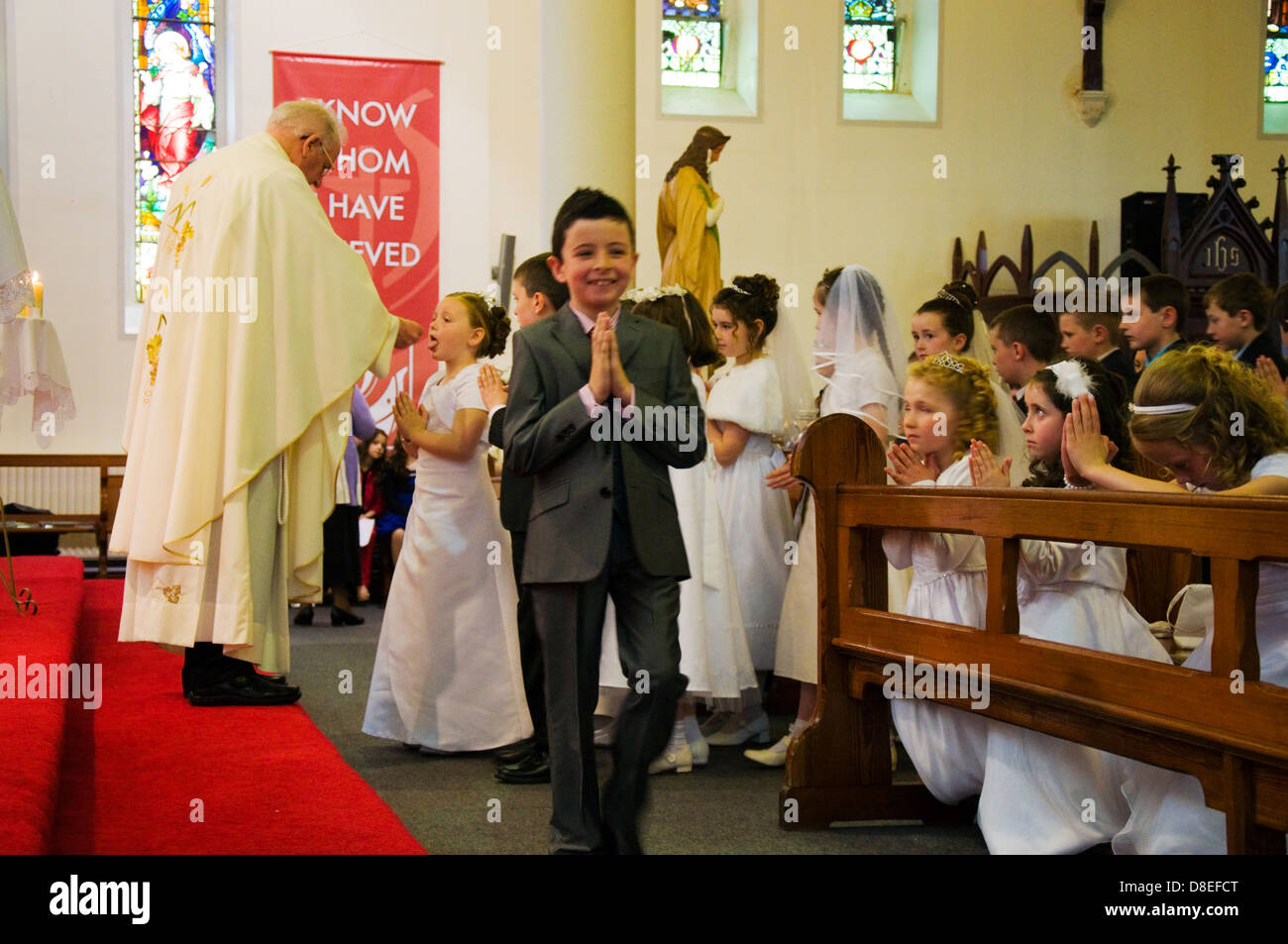 Children at a First Communion Mass Stock Photo - Alamy