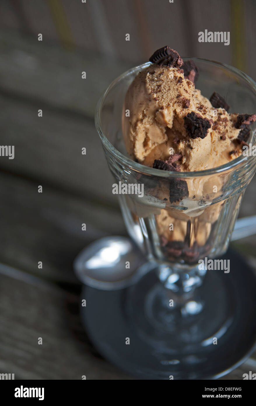 Caramel Icecream with broken Oreo cookies Stock Photo - Alamy