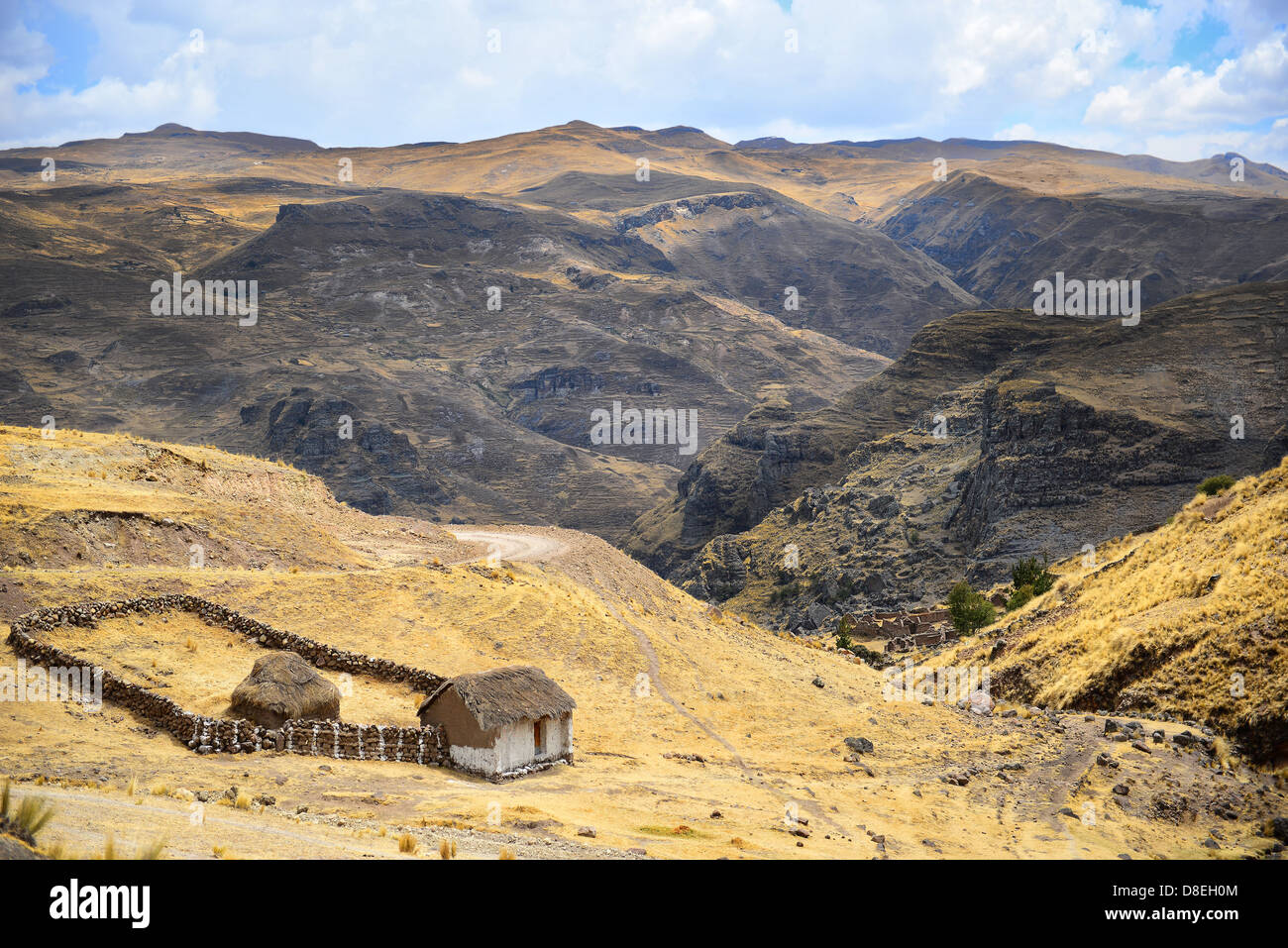 Little peasant hut in mountains. Ancient ruins and mountains in the ...