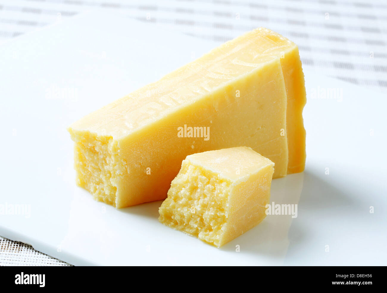Pieces of Italian hard cheese Stock Photo - Alamy