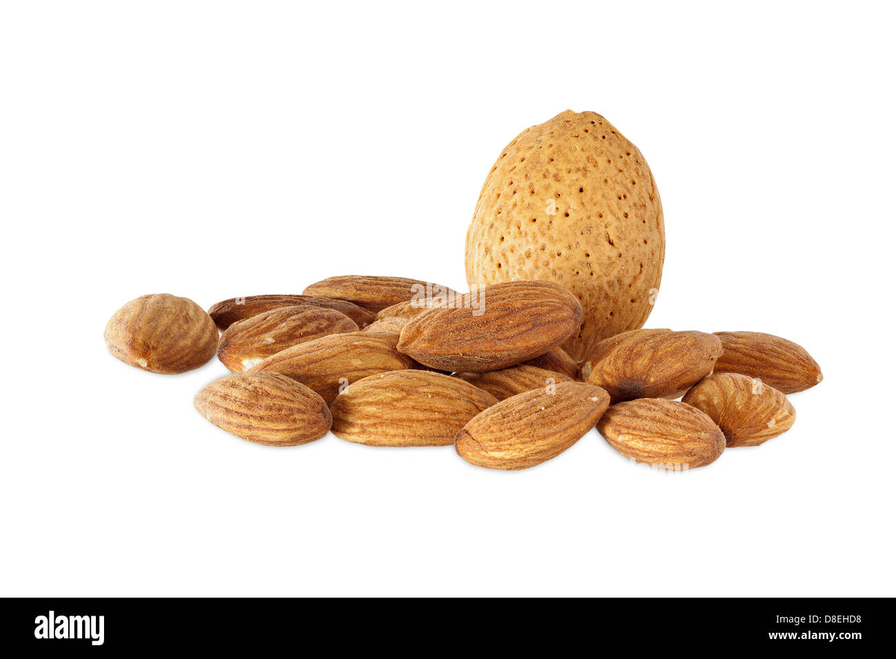 Many almond kernels and a whole almond isolated in front of white ...