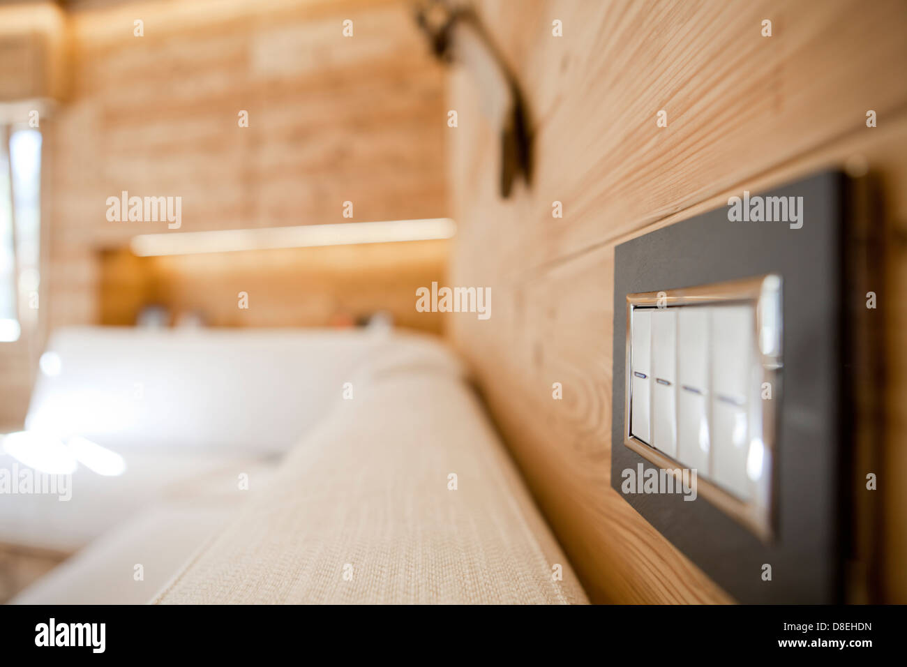 Electrical plug in on wooden wall Stock Photo - Alamy