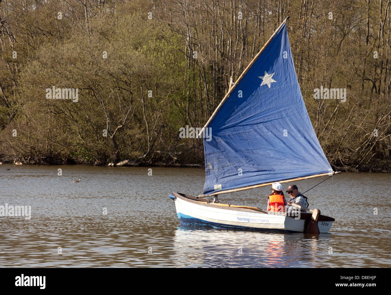 Two people sailing in a sailboat, Salhouse broad, Norfolk Broads, East ...