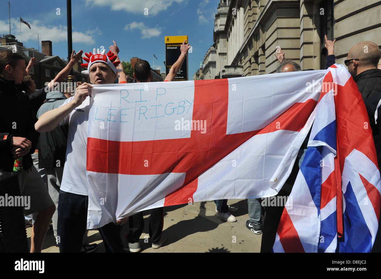 Whitehall, London, UK. 27th May 2013. Members of the EDL hold flags and ...