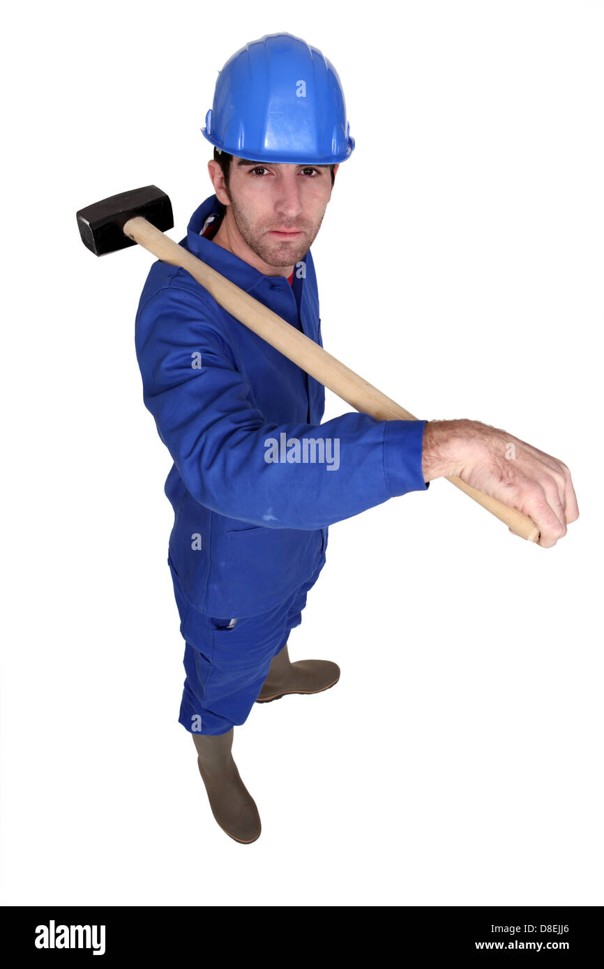 Man carrying sledge hammer Stock Photo - Alamy