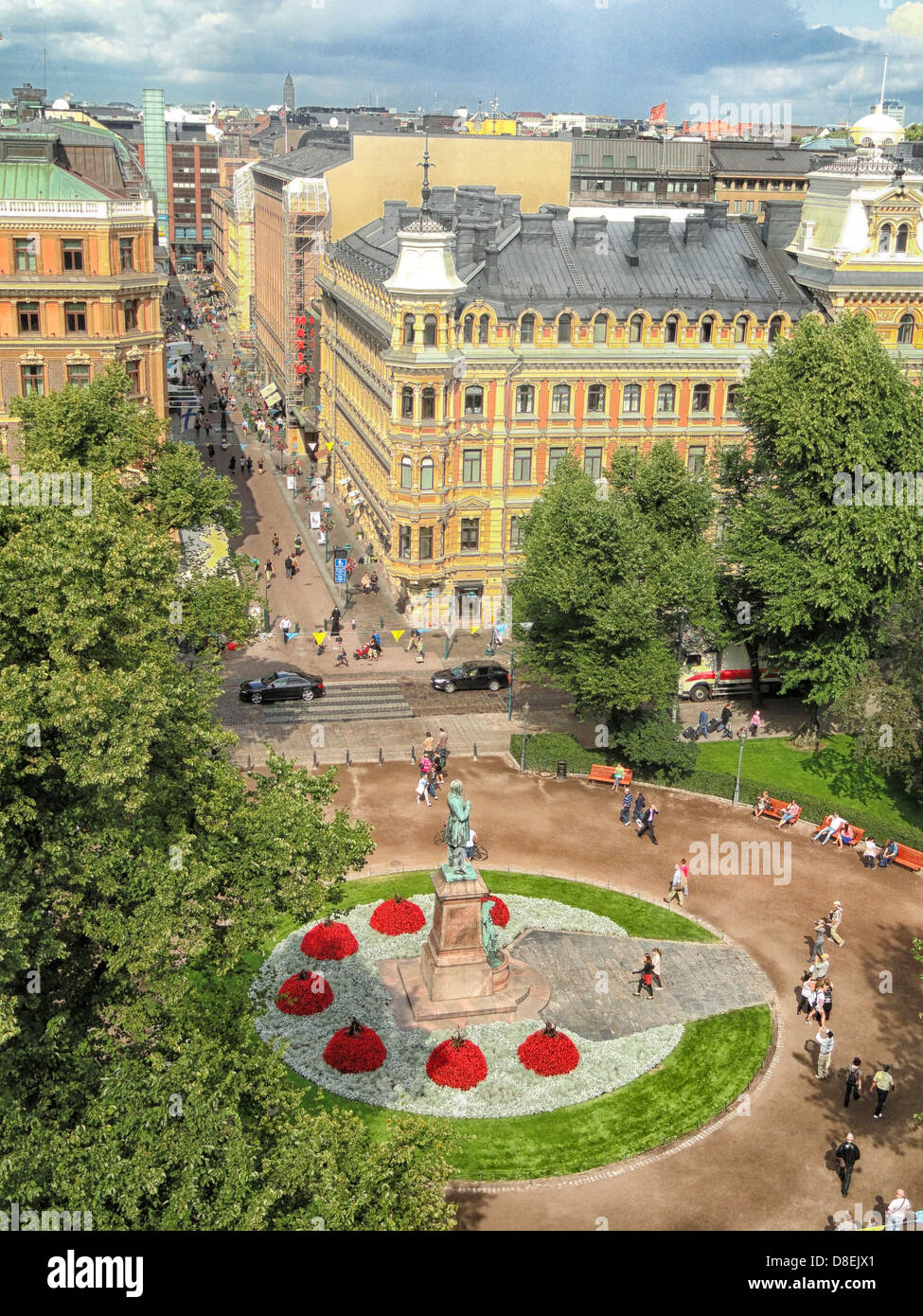 A view of Helsinki, Finland, with a plaza featuring flowers, buildings ...