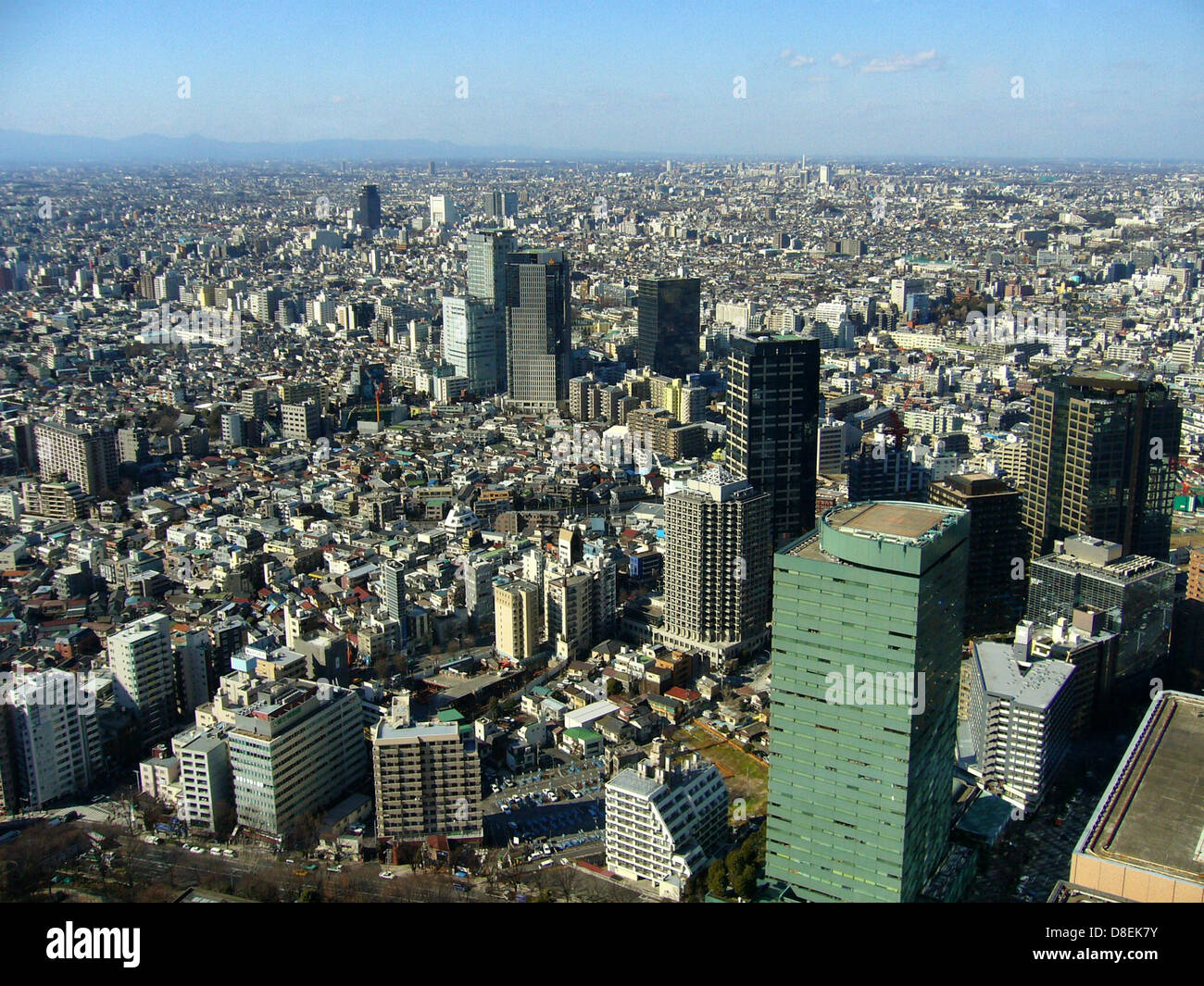 The city of Tokyo features a striking urban skyline, with a mix of ...