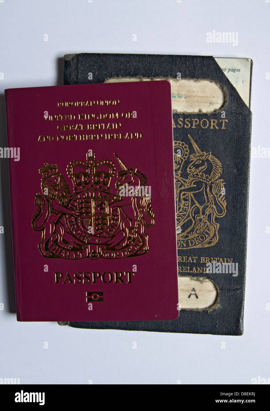 modern red passport and old large black british passports Stock Photo ...