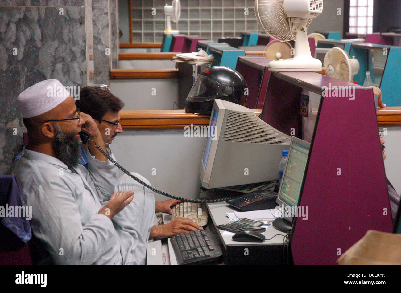 Pakistani stockbroker busy in trading during a trading session at the ...