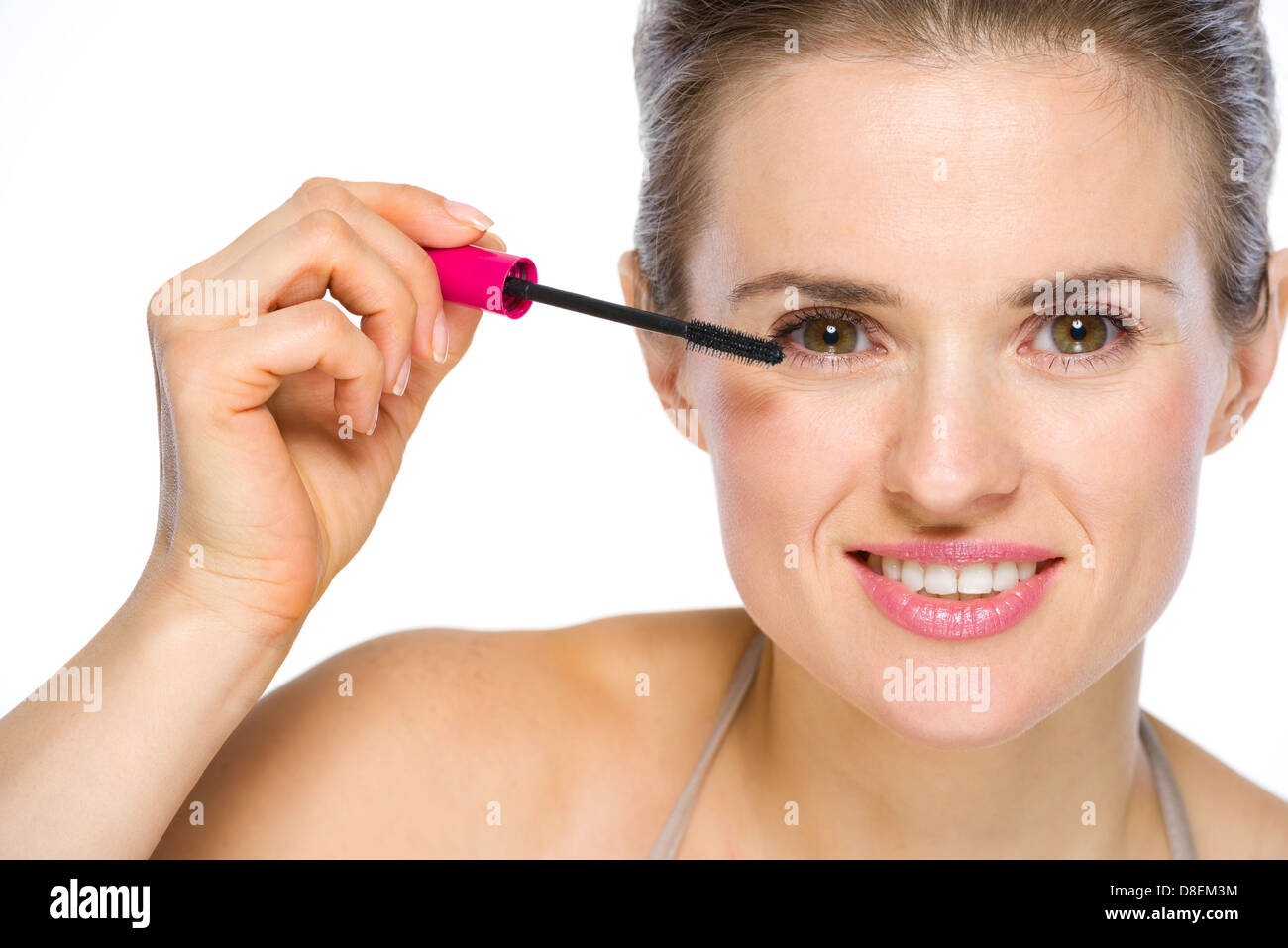 Beauty portrait of happy young woman applying mascara Stock Photo - Alamy