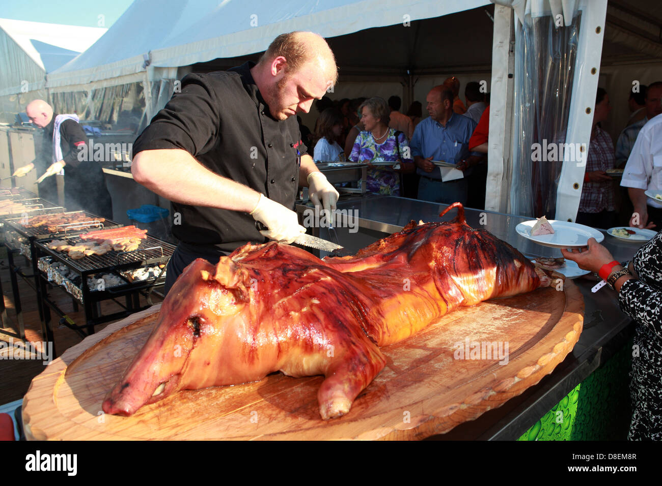 Hannover, Germany, a man cuts of pork from Fleischstuecke Stock Photo ...