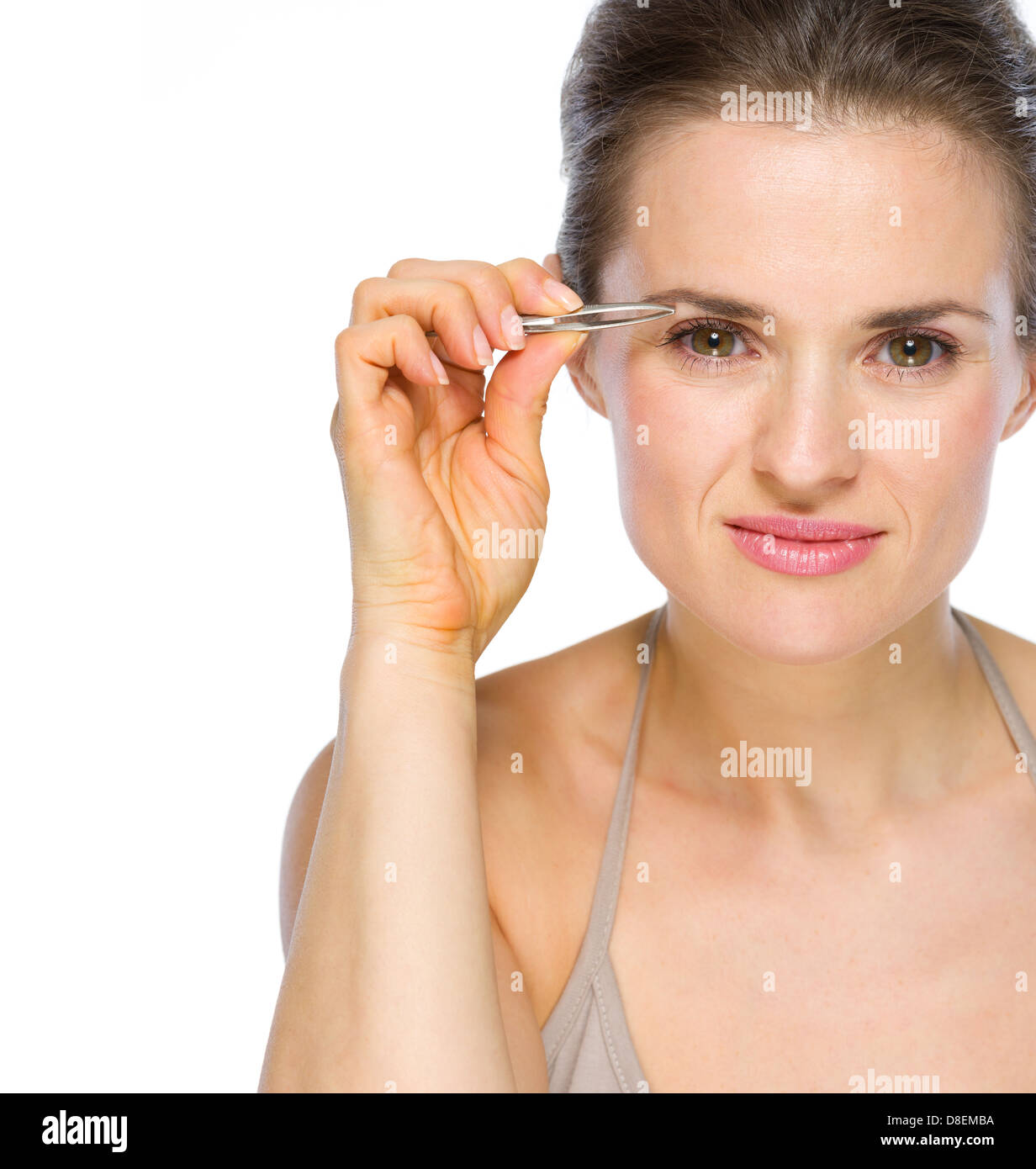 Beauty portrait of young woman using tweezers Stock Photo - Alamy