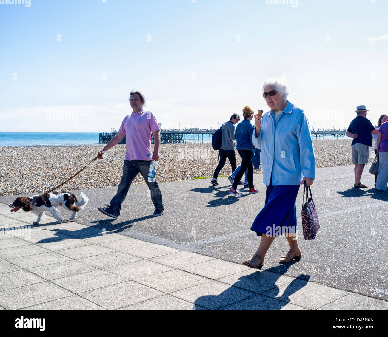 Man and woman walking eating ice cream hi-res stock photography and ...