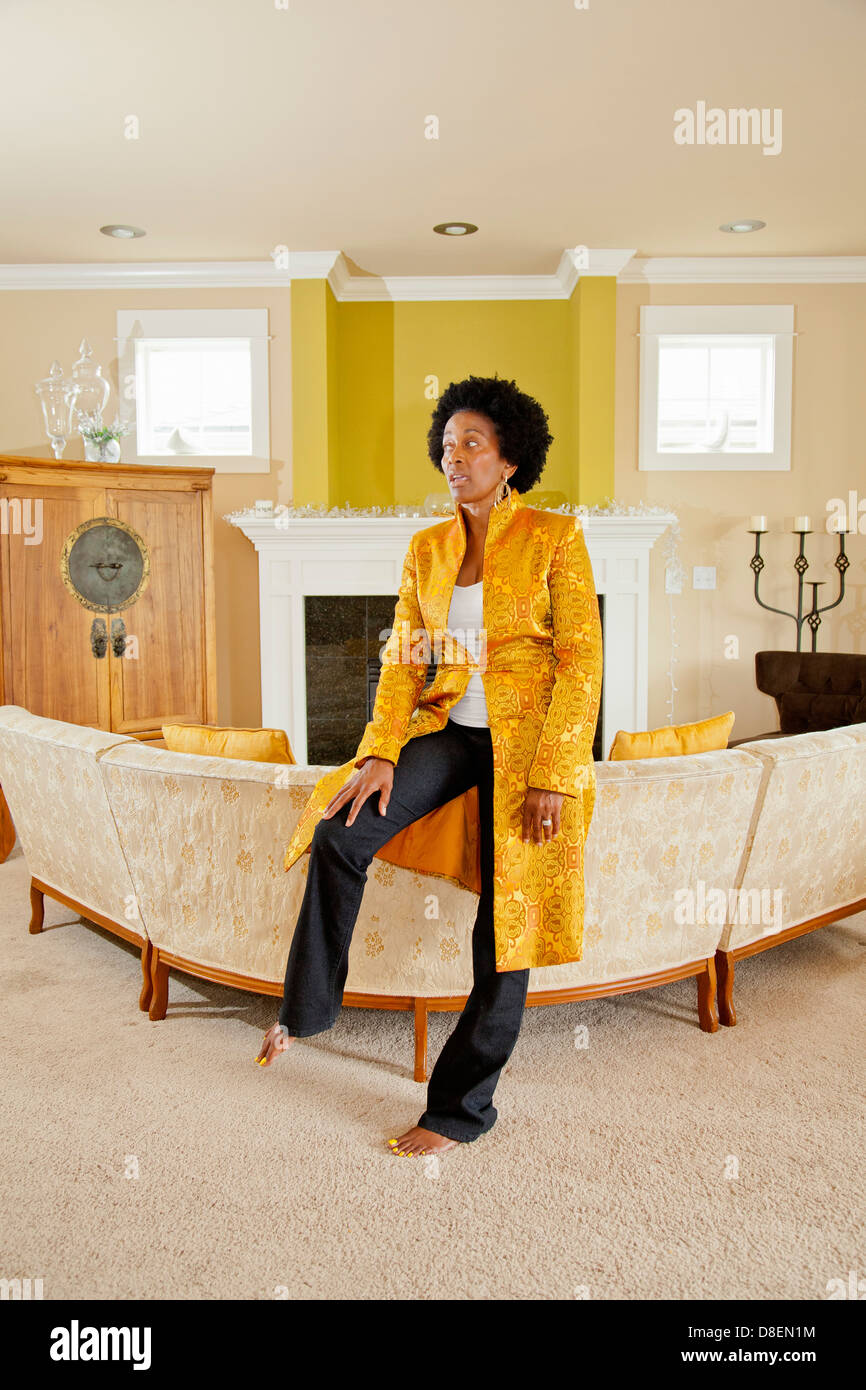 Elegant woman in formal living room Stock Photo - Alamy