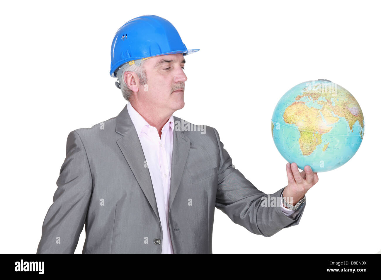 Engineer holding a globe Stock Photo - Alamy