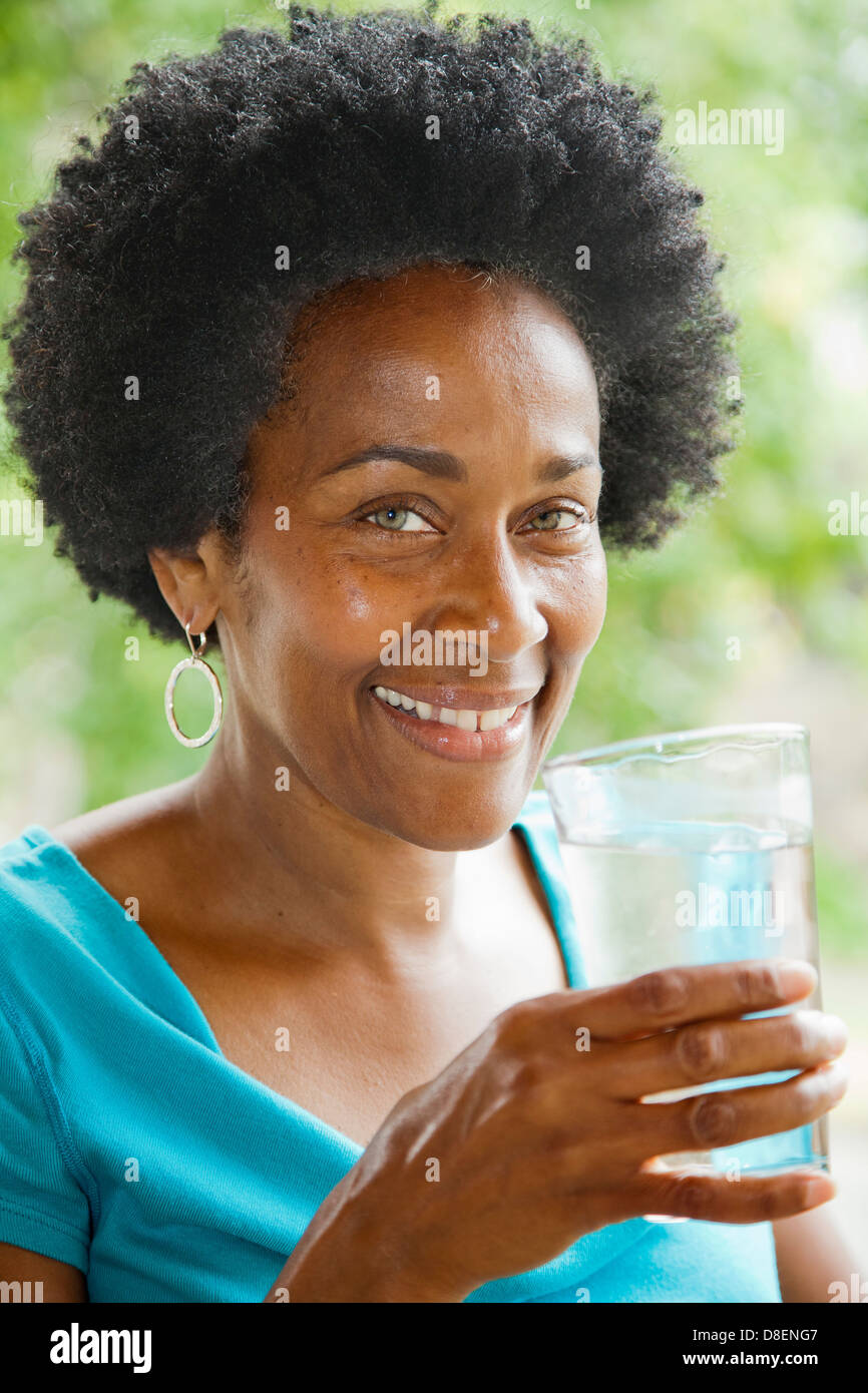 Woman curly hair glasses smiles hi-res stock photography and images - Alamy