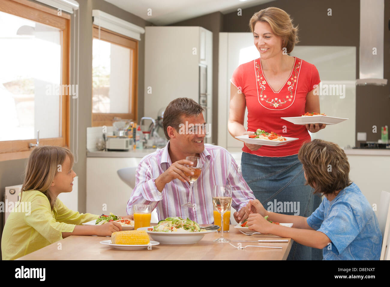 Family eating together Stock Photo - Alamy