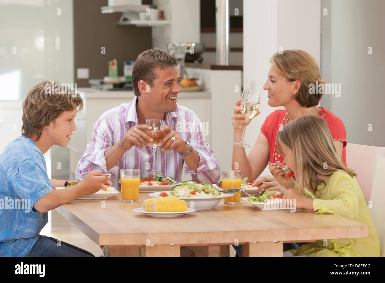 Family eating together Stock Photo - Alamy