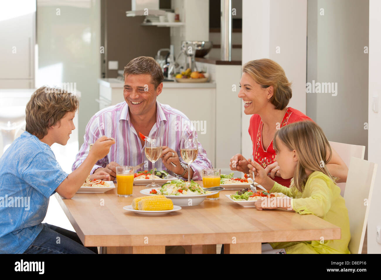 Family eating together Stock Photo - Alamy