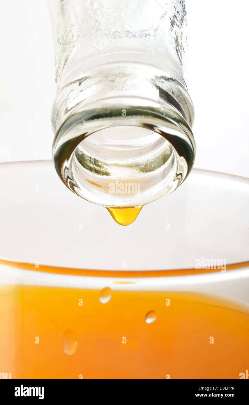 orange juice drop from orange juice bottle Stock Photo - Alamy